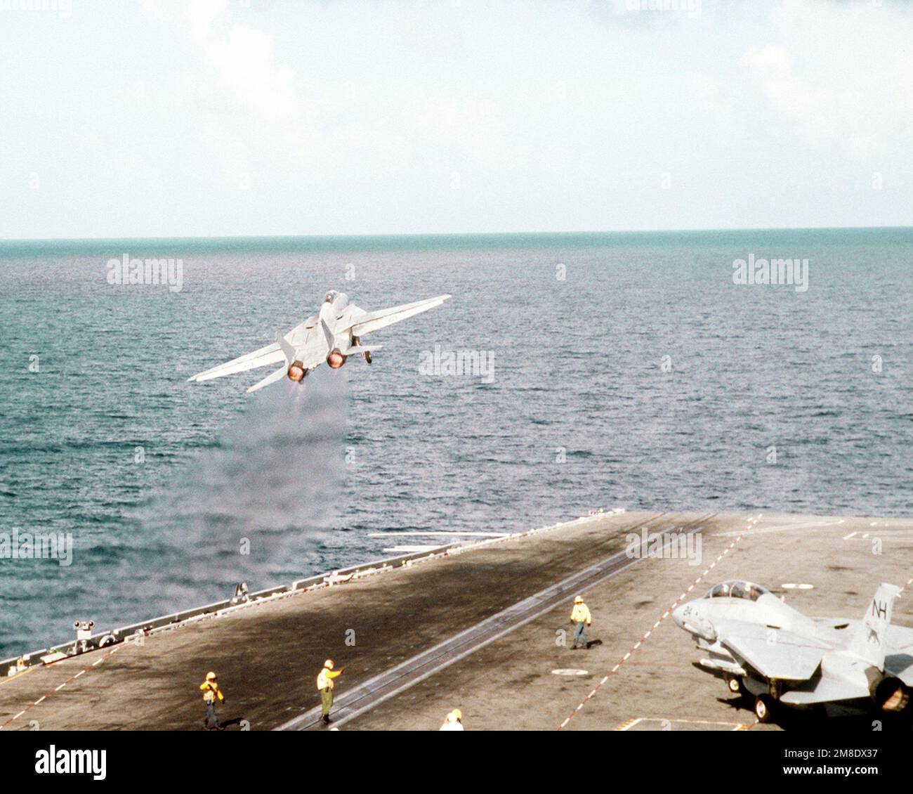 A Fighter Squadron 114 (VF-114) F-14A Tomcat aircraft leaves the flight ...