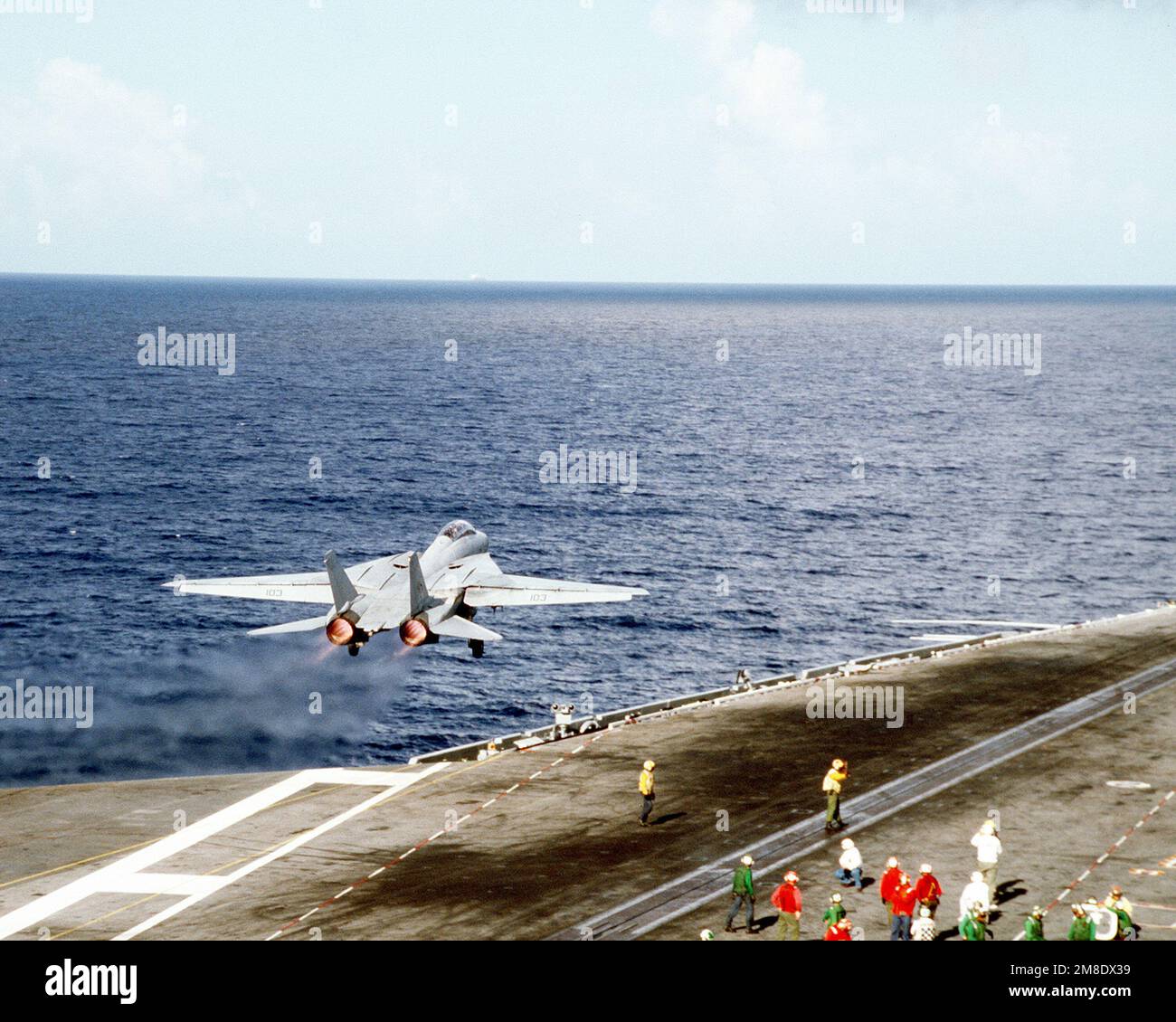 A Fighter Squadron 114 (VF-114) F-14A Tomcat aircraft leaves the flight ...
