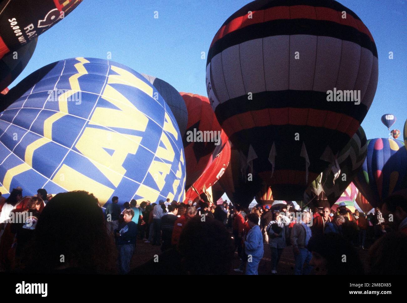 Onlookers gather around a U.S. Navy hot air balloon which is being ...