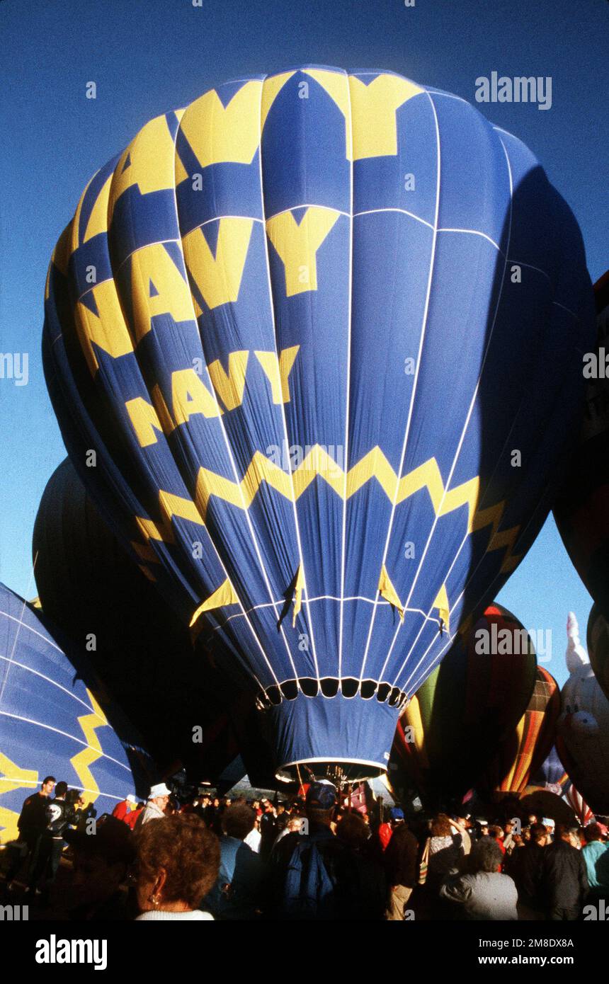 Onlookers gather around a U.S. Navy hot air balloon as a second Navy ...