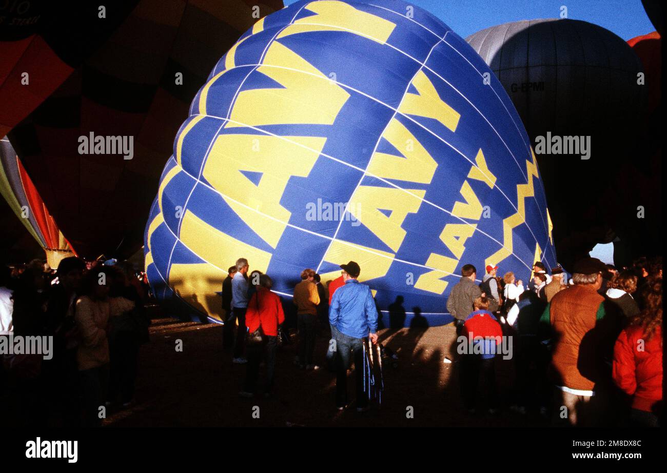 Onlookers gather around a U.S. Navy hot air balloon which is being ...