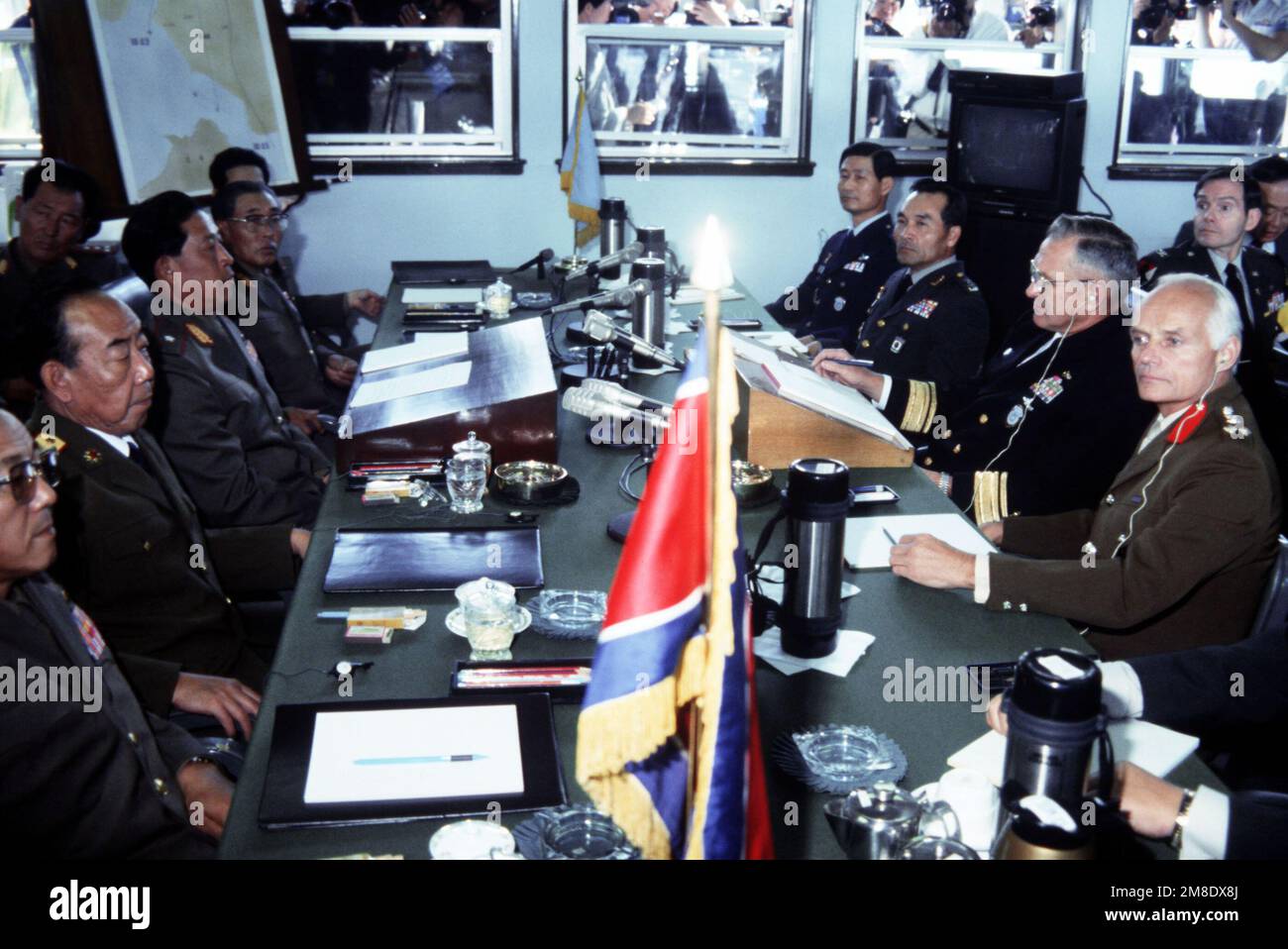 Rear Admiral Larry G. Vogt, center right, and other senior members of ...