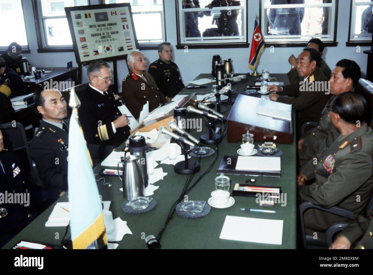 Rear Admiral Larry G. Vogt, center left, and other senior members of ...