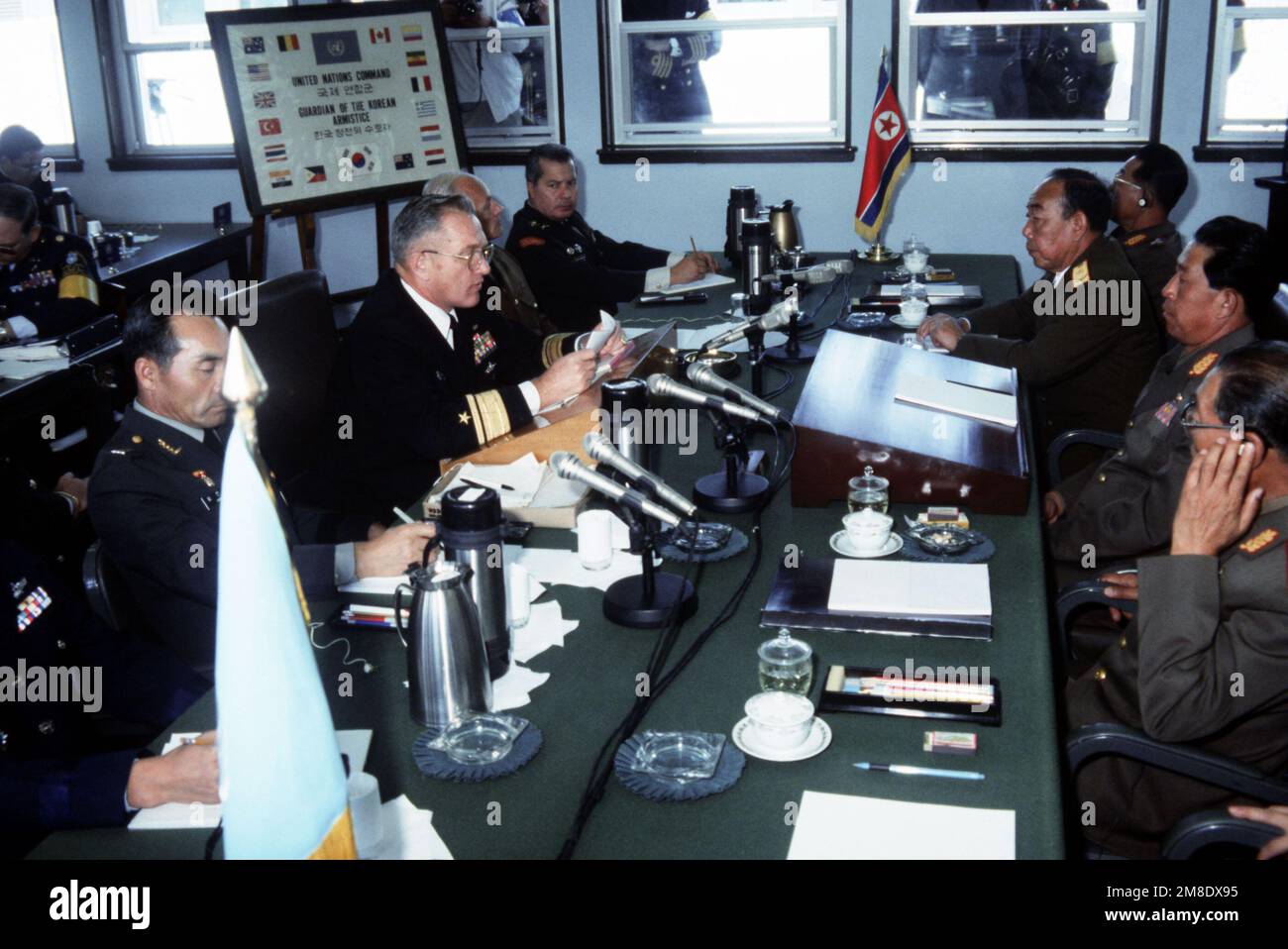Rear Admiral Larry G. Vogt, center left, and other senior members of ...