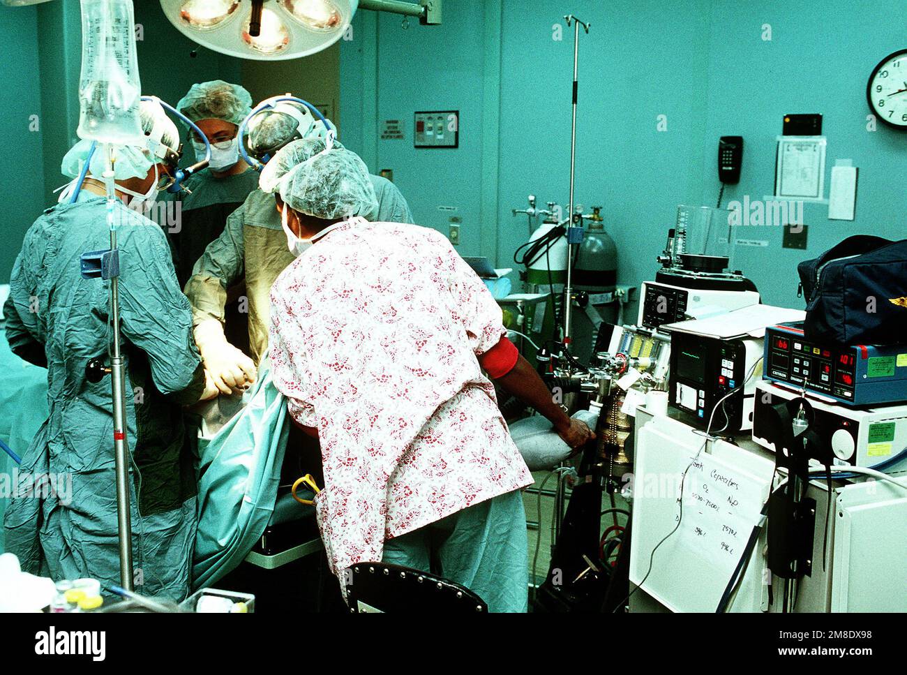 Doctors perform surgery aboard the hospital ship USNS MERCY (T-AH-19 ...