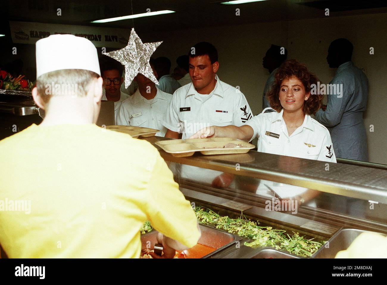 A mess management specialist services meals aboard the hospital ship ...