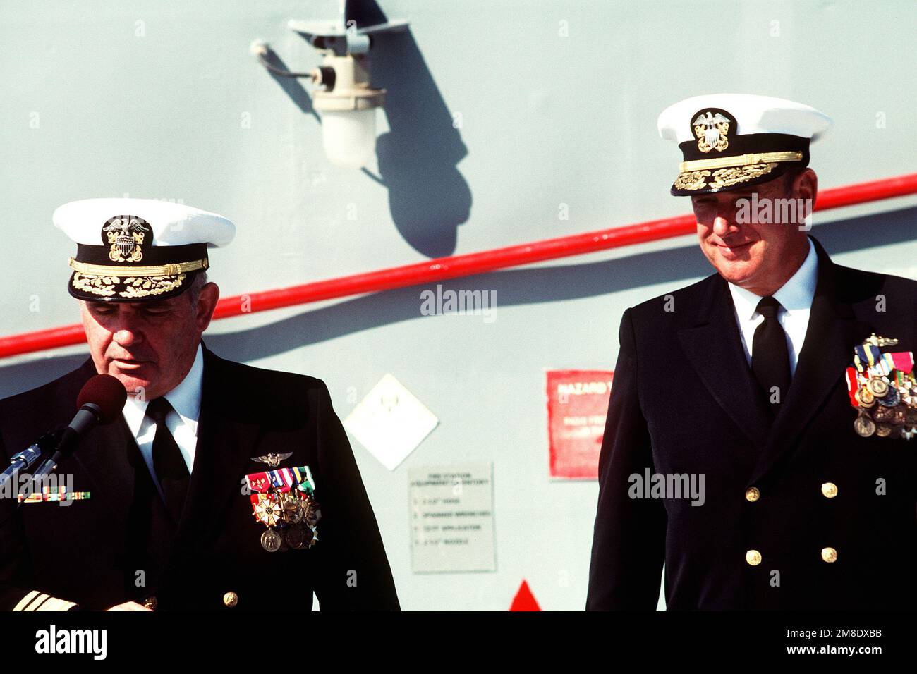 Vice Adm. Stanley R. Arthur speaks as Vice Adm. Henry H. Mauz stands by ...