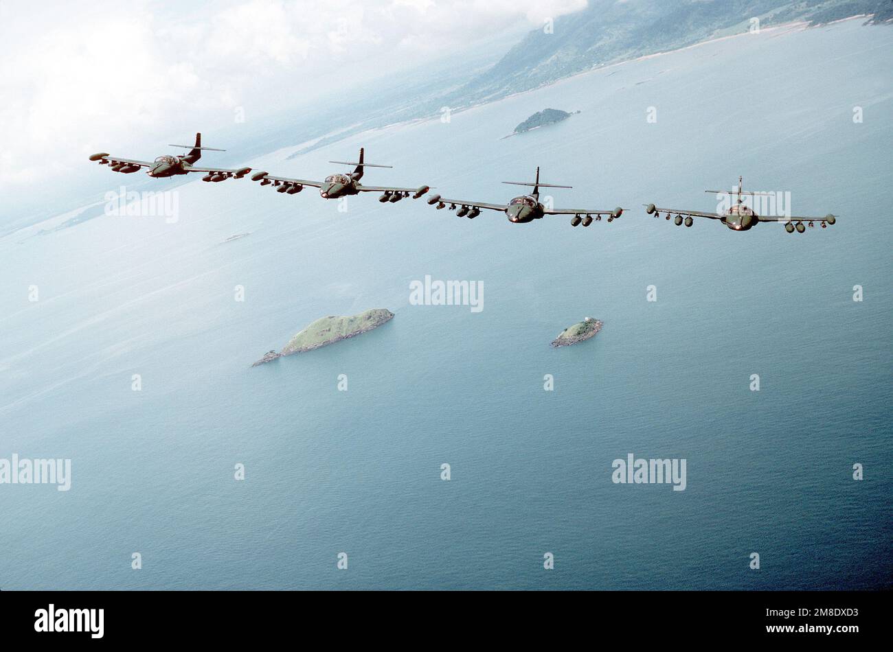 An air-to-air front view of an OA-37B Dragonfly aircraft in formation ...