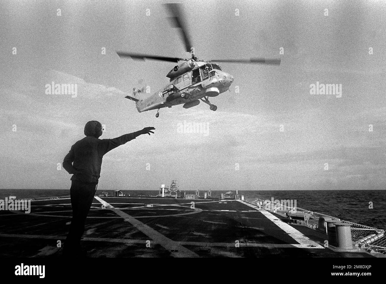 A member of Helicopter Light Anti-submarine Squadron 94 (HSL 94 ...