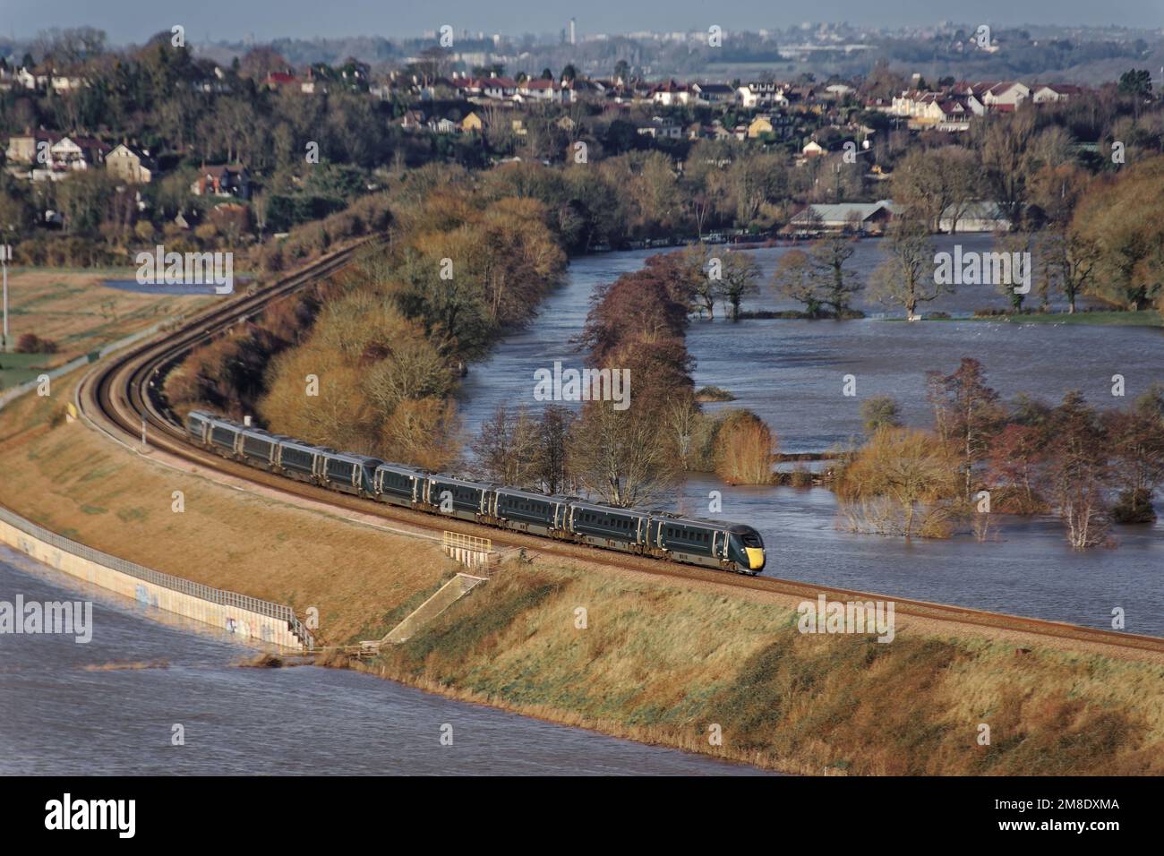 railway line above the flooded fields of Newton Meadows between Bath ...