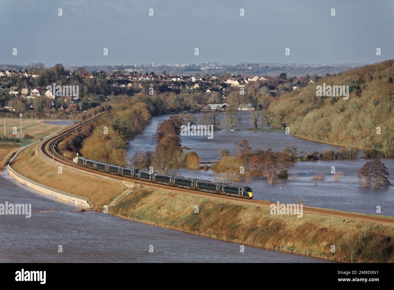 railway line above the flooded fields of Newton Meadows between Bath ...