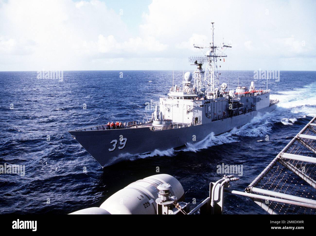 The guided missile frigate USS DOYLE (FFG-39) comes alongside the ...