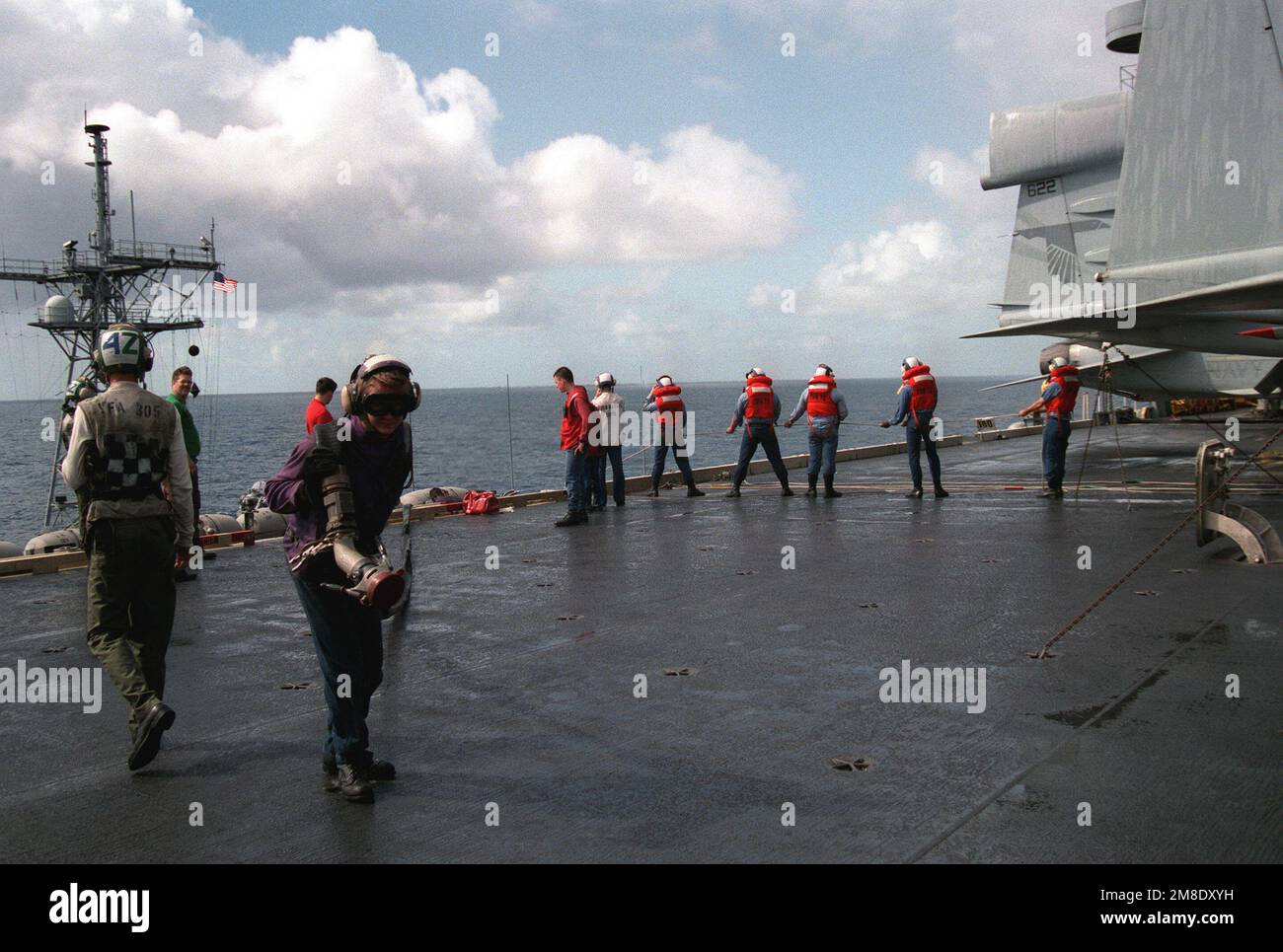 Crew Members Aboard The Nuclear Powered Aircraft Carrier Uss Abraham