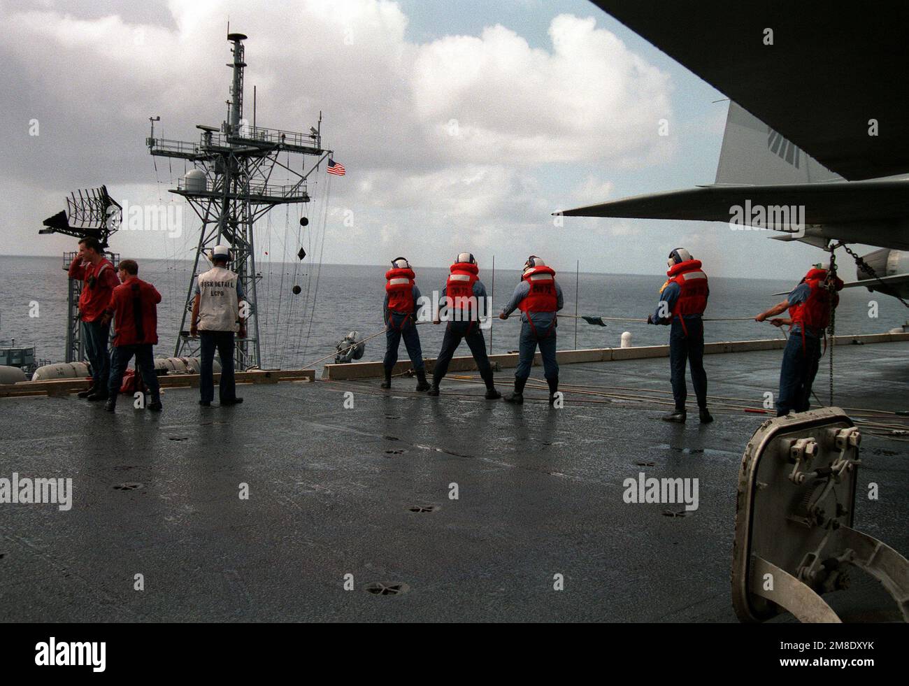 Crew Members Aboard The Nuclear Powered Aircraft Carrier Uss Abraham