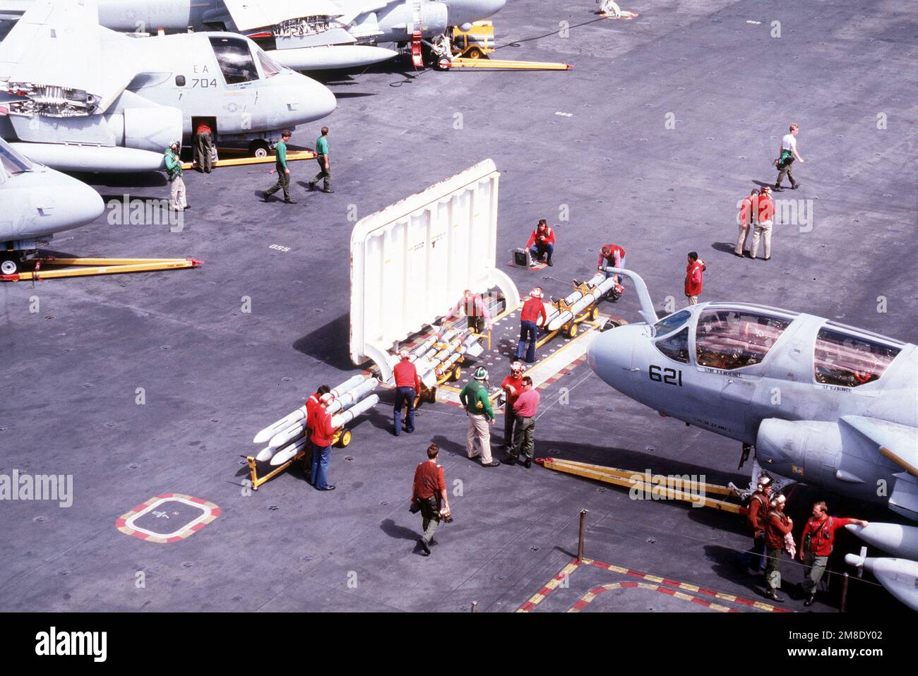 Aviation ordnancemen remove Aero 21A weapons skids loaded with AIM-9 ...
