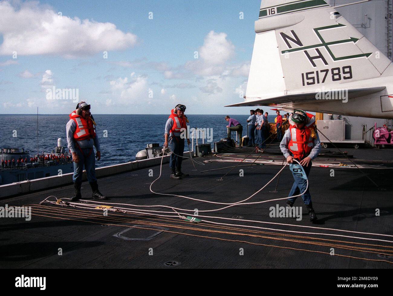 Crew Members Aboard The Nuclear Powered Aircraft Carrier Uss Abraham