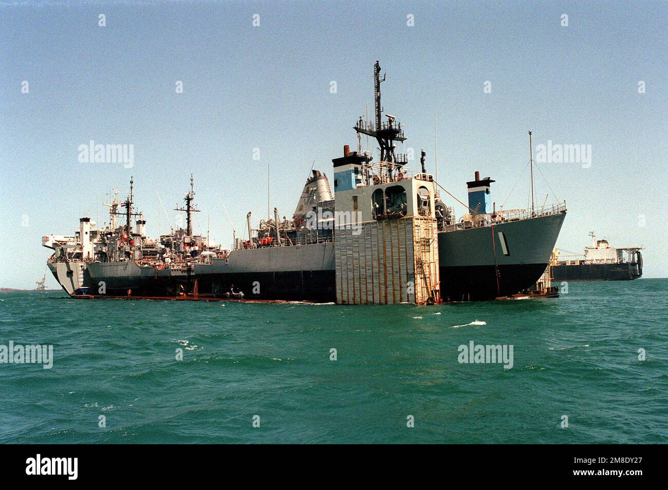 The mine countermeasures ship USS AVENGER is positioned on the deck of ...