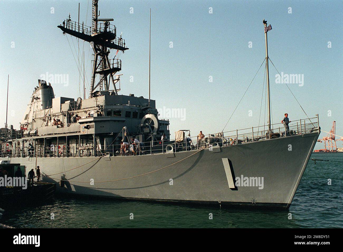The mine countermeasures ship USS AVENGER (MCM-1) is moored to the pier ...