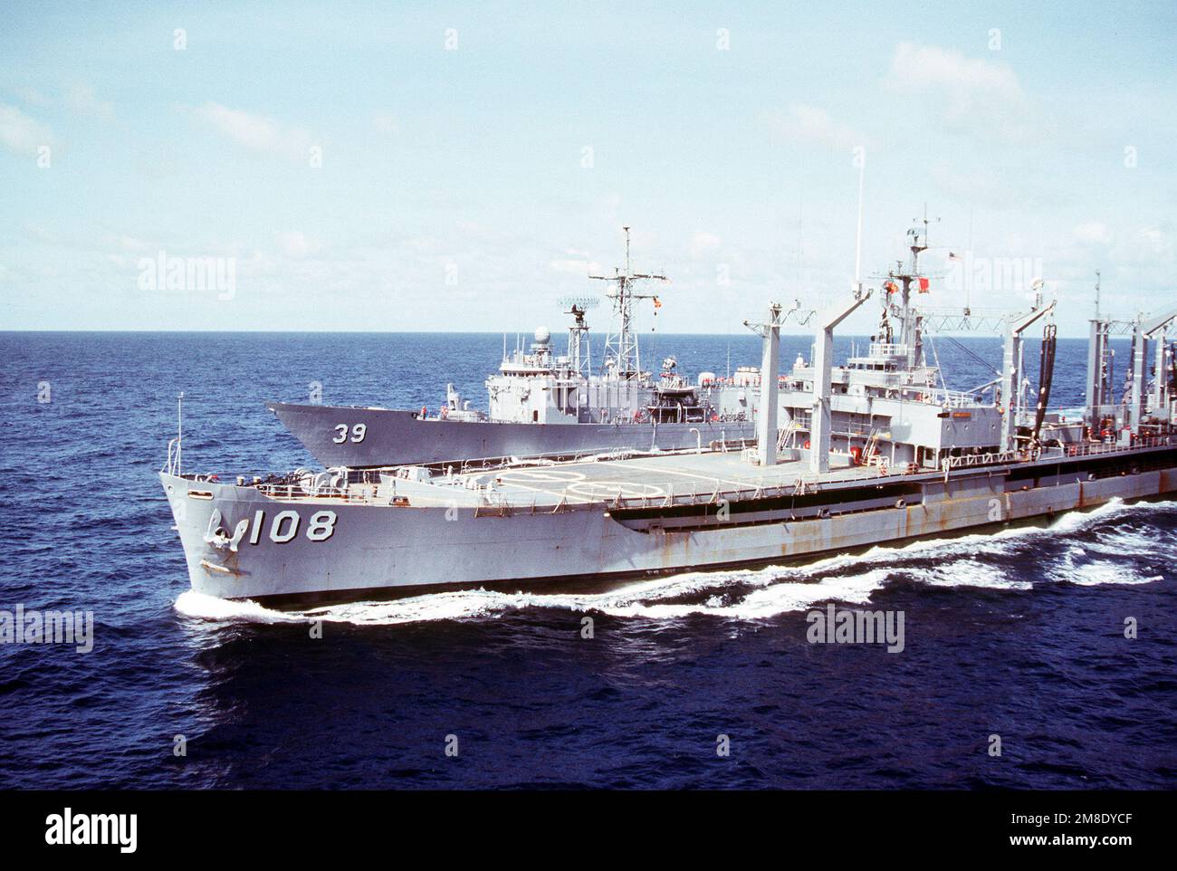 The guided missile frigate USS DOYLE (FFG-39) and the fleet oiler USNS ...