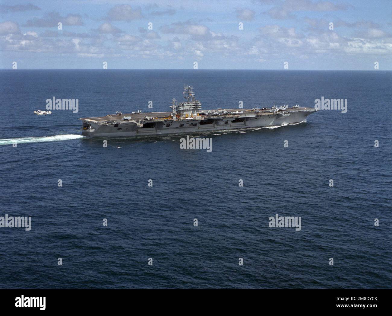 A C-2A Greyhound aircraft comes in for a landing on a flight deck of ...