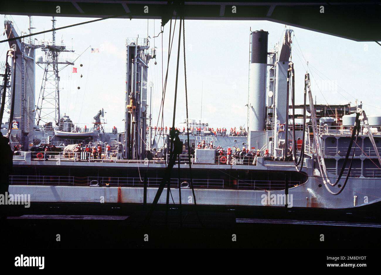 A view of crew members aboard the fleet oiler USNS PAWCATUCK (T-AO-108 ...