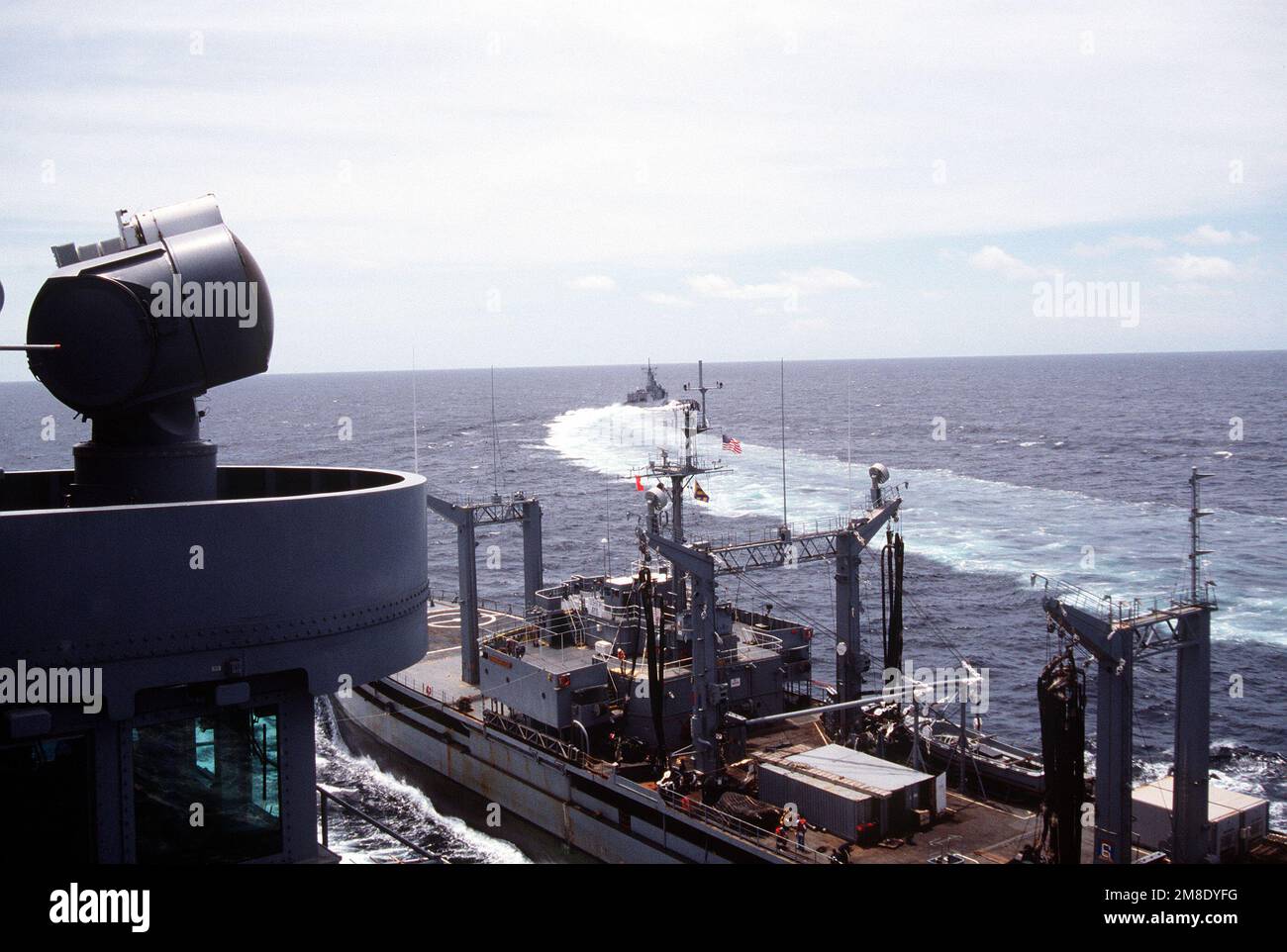 The guided missile frigate USS DOYLE (FFG-39) moves away after taking ...