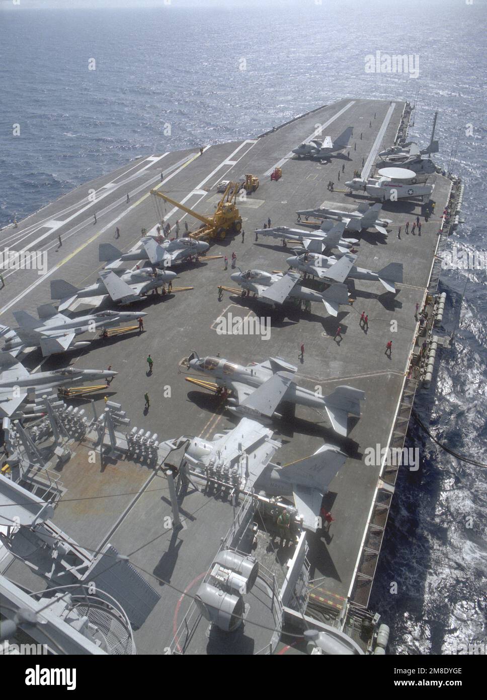 Various aircraft line the flight deck of the nuclear-powered aircraft ...