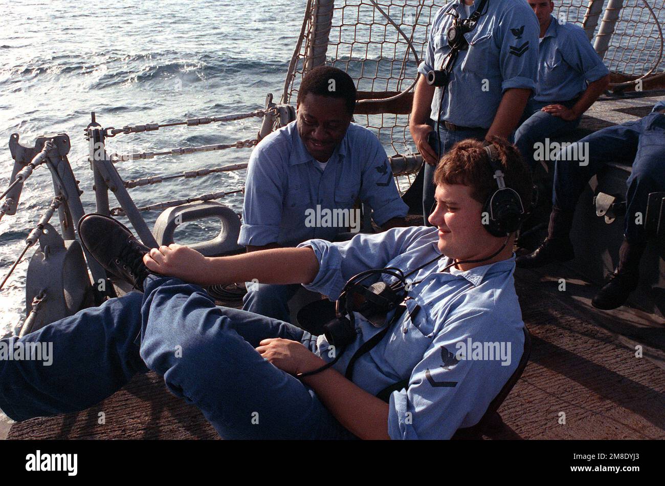 A lookout on the fantail of the guided missile frigate USS TAYLOR (FFG ...