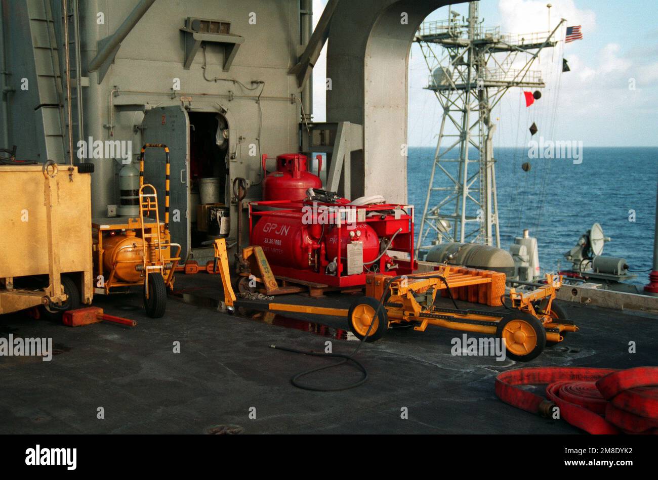 A firefighting cart is loaded with containers of aqueous film forming ...