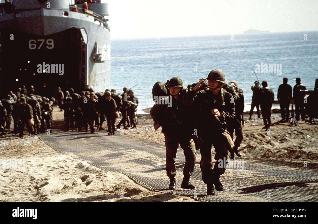 South Korean marines move up the beach after disembarking from the ...