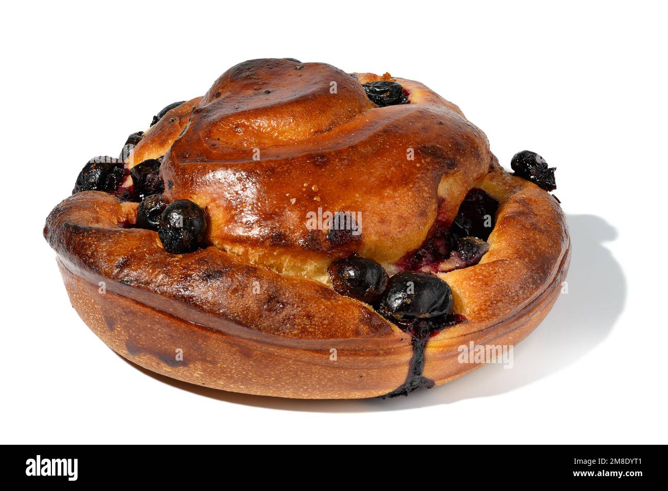 Baked round bun with cherry berries on a white isolated background ...