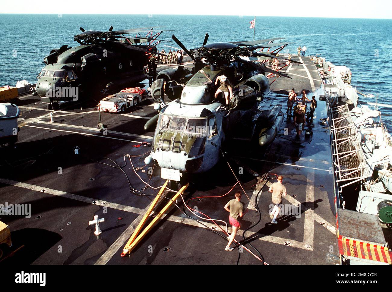 Marines exercise on the flight deck of the amphibious transport dock ...