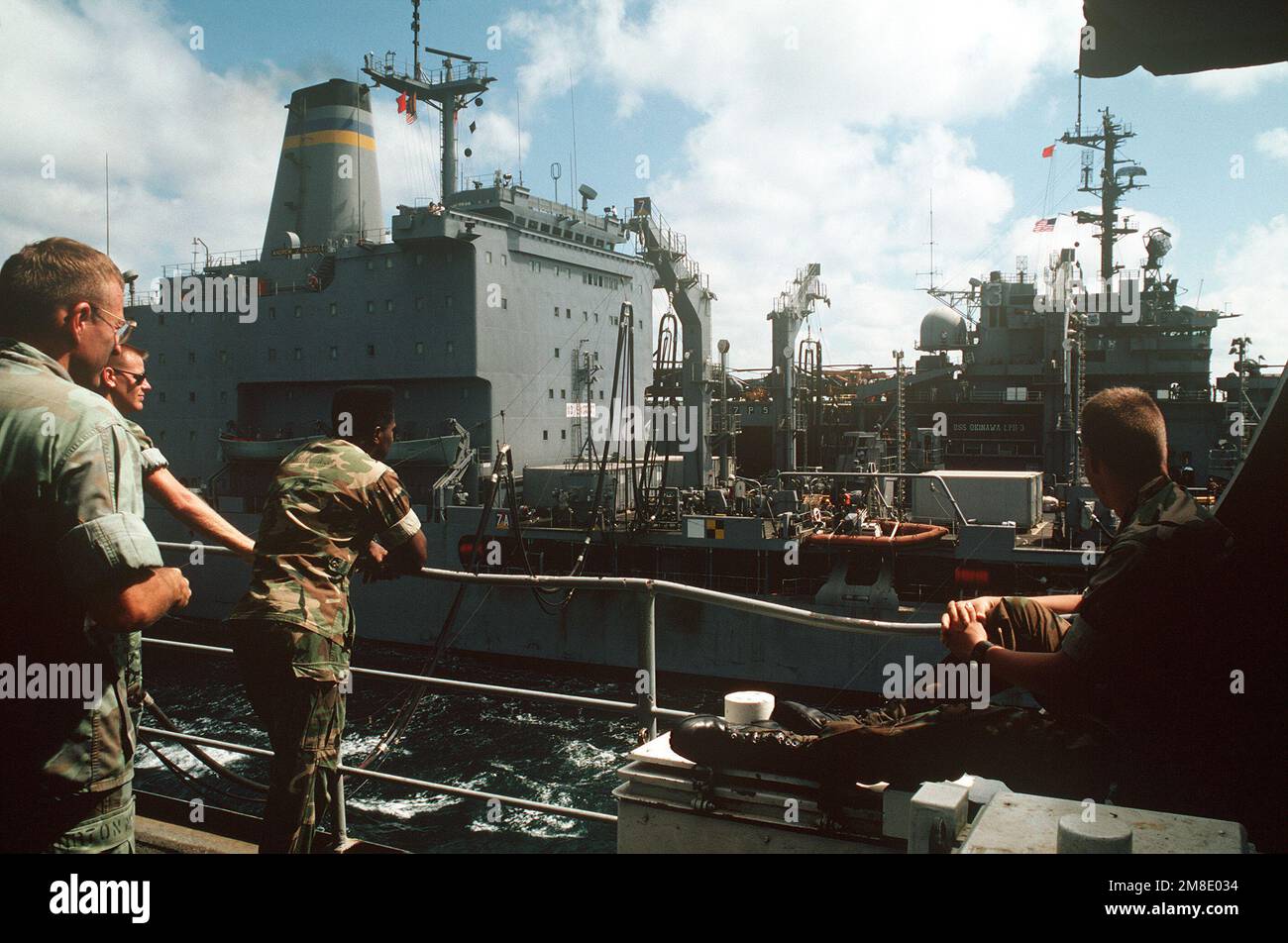 Four Marines aboard the amphibious transport dock USS RALEIGH (LPD 1 ...