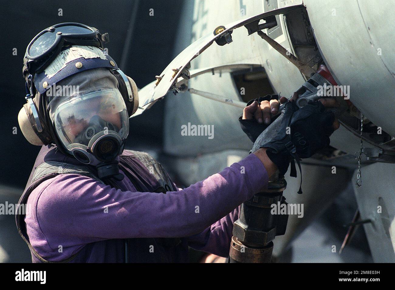 Wearing an MCU-2P protective mask as part of a Nuclear-Biological ...