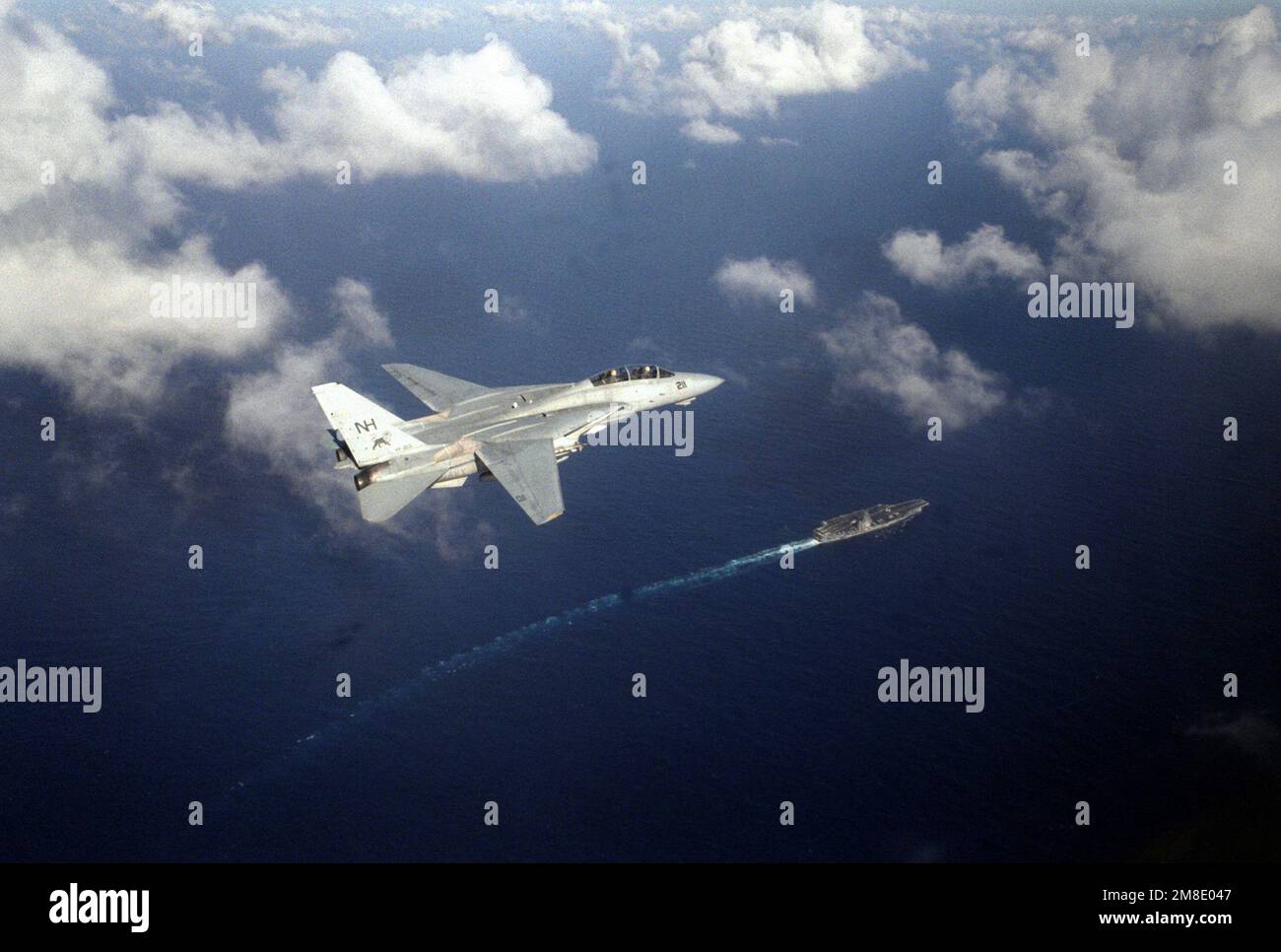 A Fighter Squadron 213 (VF-213) F-14A Tomcat aircraft flies over the ...