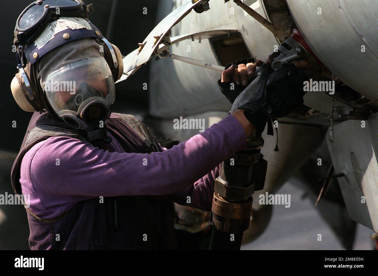 Wearing an MCU-2P protective mask as part of a nuclear-biological ...