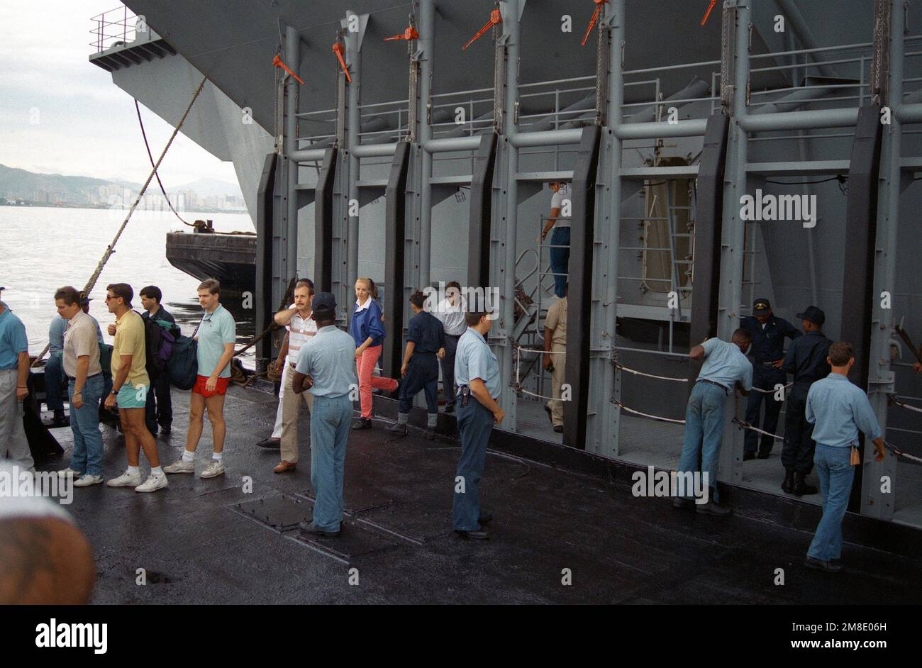 Crew members from the nuclear-powered aircraft carrier USS ABRAHAM ...