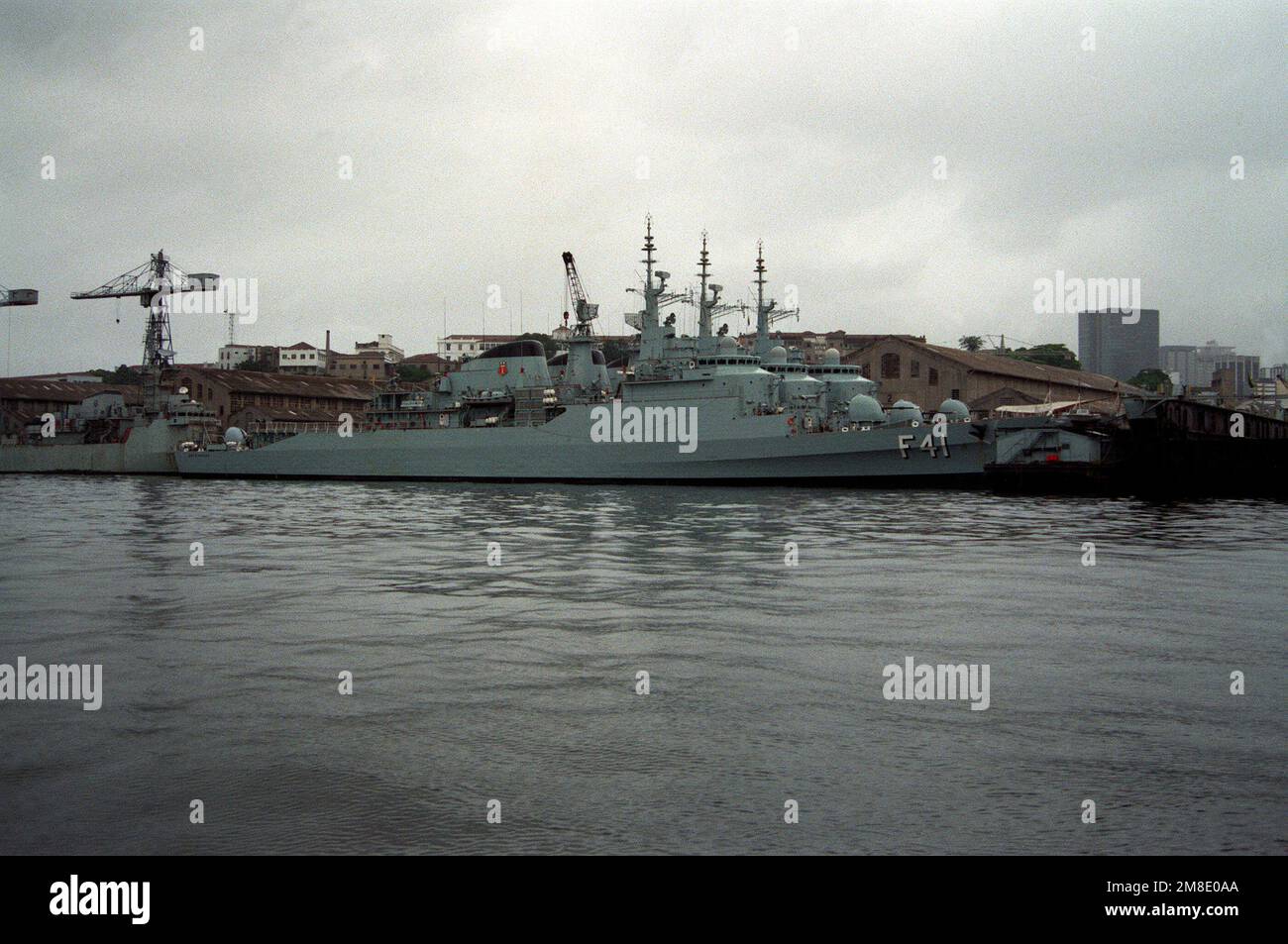 A starboard beam view of the Brazilian frigate DEFENSORA (F-41) and two ...