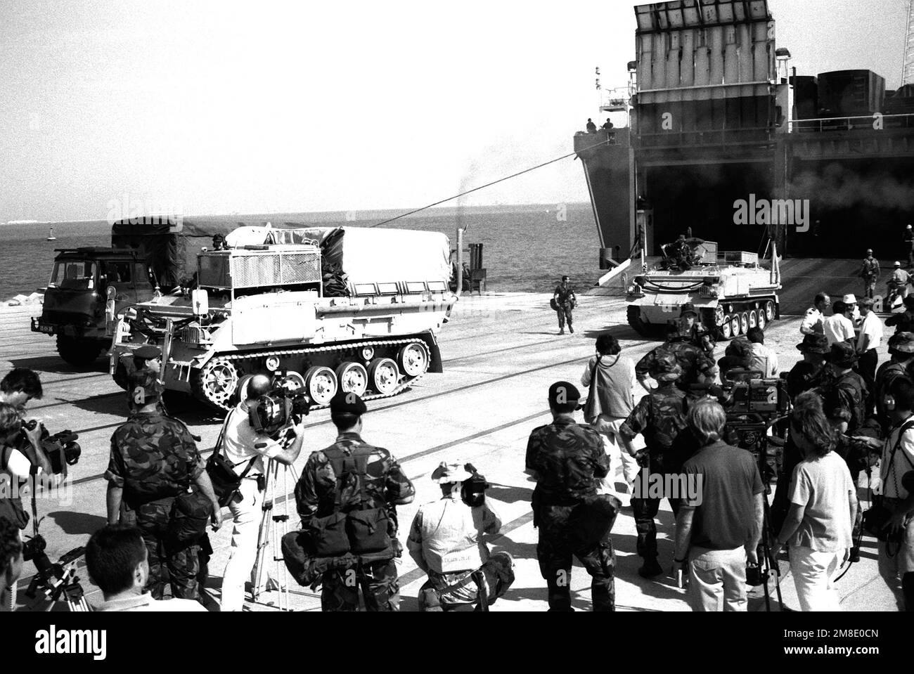 As members of the news media look on, two FV432 armored vehicles ...
