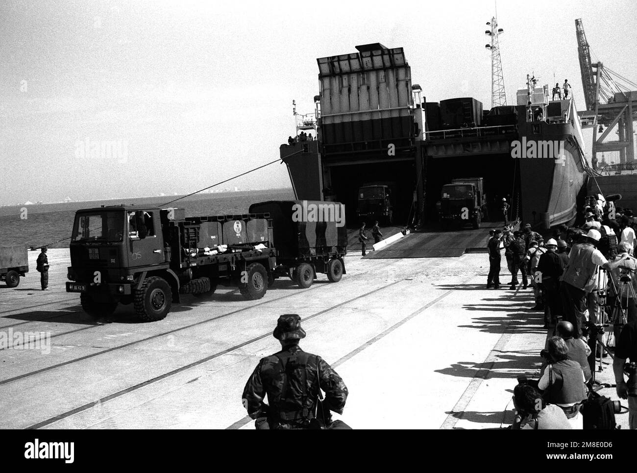 As members of the news media look on, a Bedford TM 4-4 4x4 truck ...