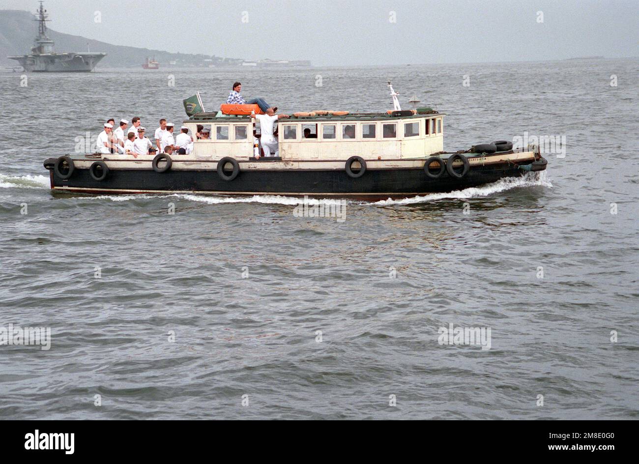A ferry shuttles crew members between the shore and the nuclear-powered ...