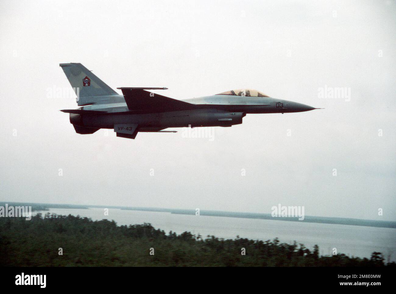 An air-to-air right side view of a Fighter Squadron 43 (VF-43) F-16N ...