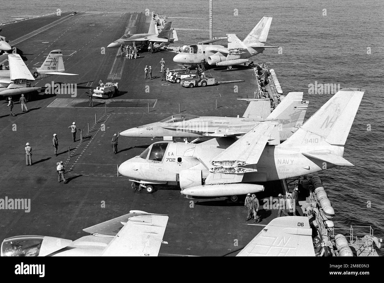 Various aircraft parked on the flight deck of the nuclear-powered ...