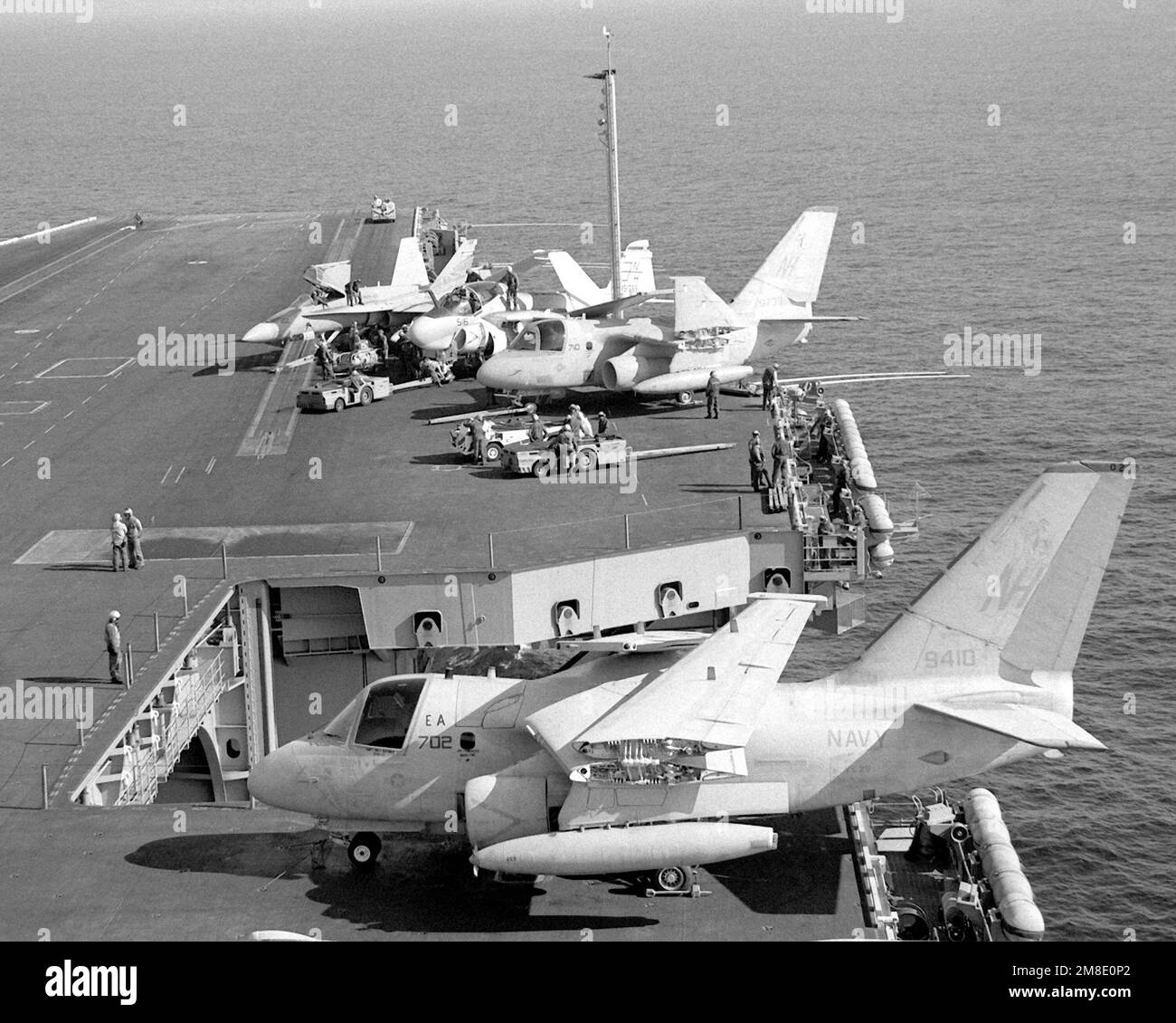 A lowered elevator transports aircraft as Air Anti-submarine Squadron ...