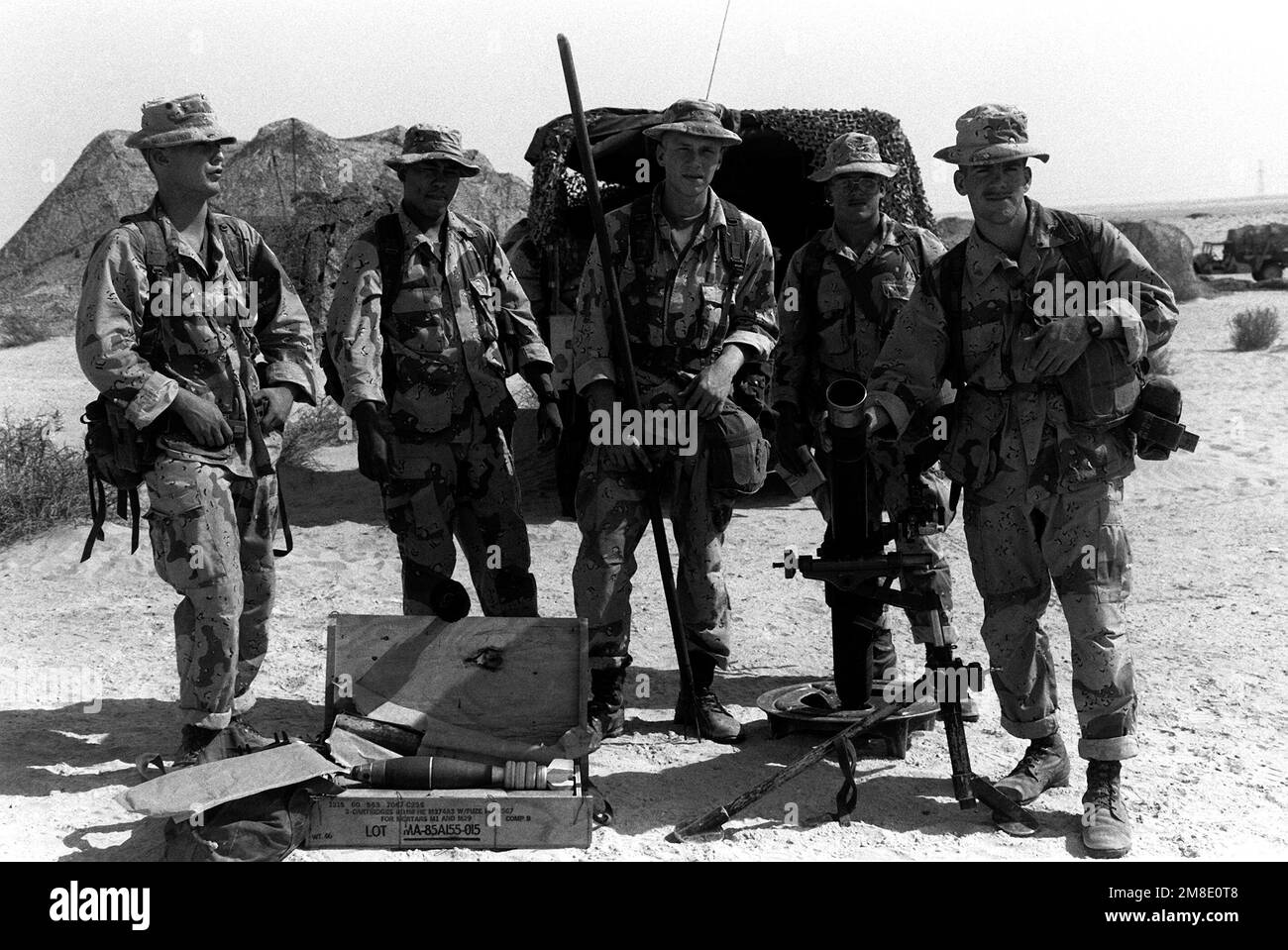 Members of a mortar crew from Weapons Co., 1ST Bn., 7th Marines, gather ...