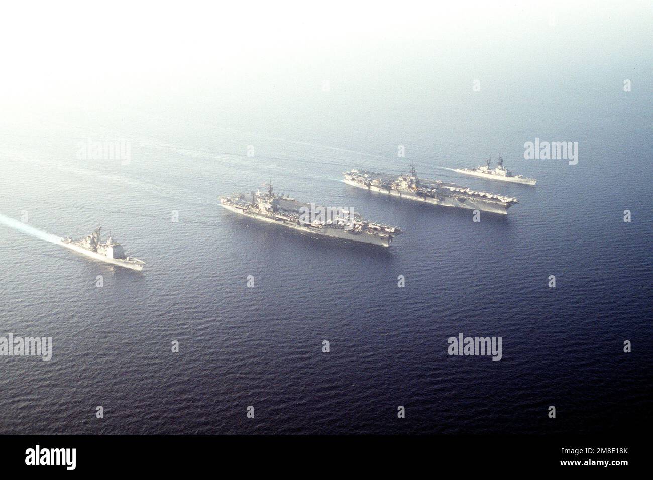An aerial view of, from left, the guided missile cruiser USS SAN ...
