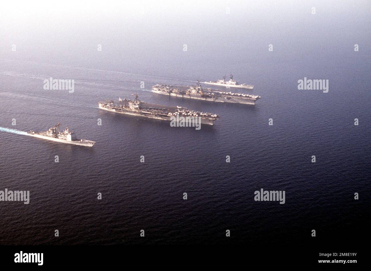 An aerial view of, from left, the guided missile cruiser USS SAN ...