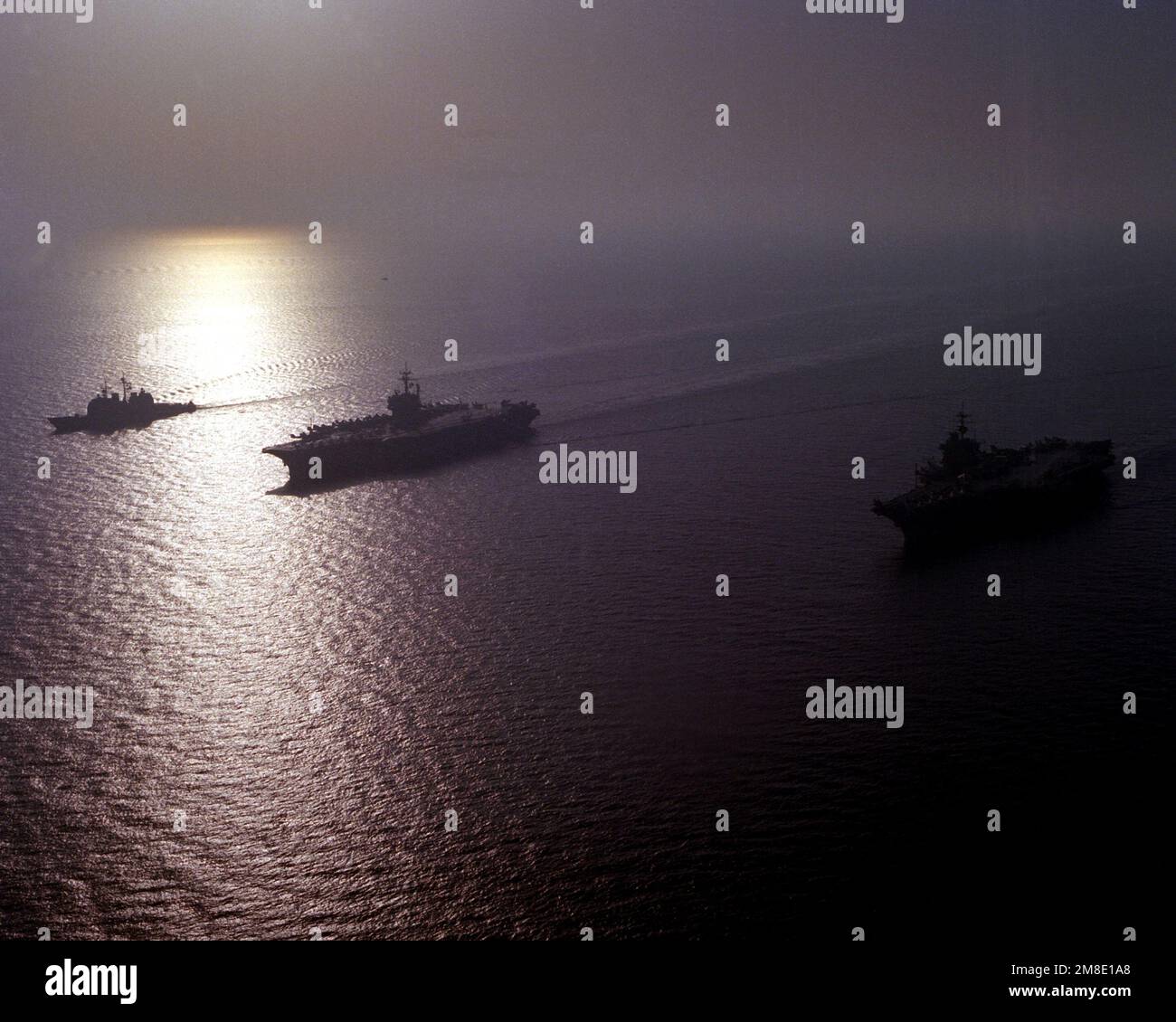 An aerial view of, from left, the guided missile cruiser USS SAN ...