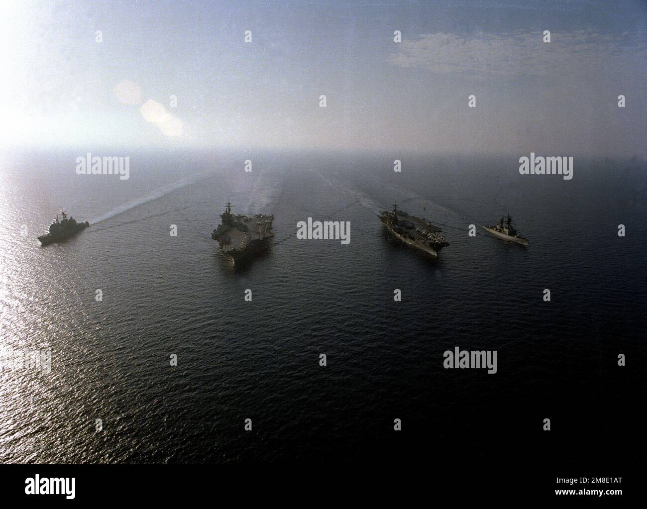 An aerial view of, from left, the guided missile cruiser USS SAN ...