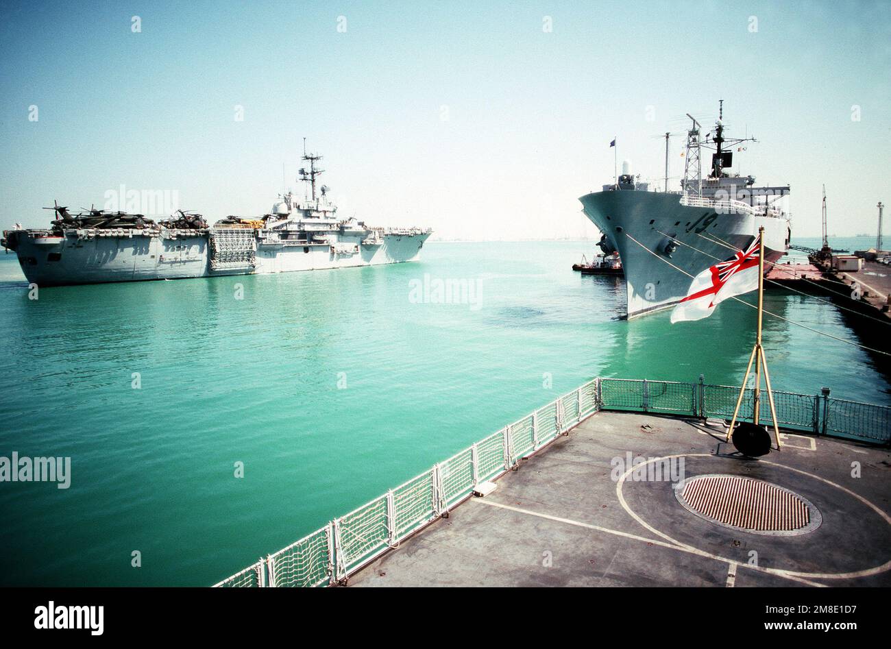 The amphibious assault ship USS IWO JIMA (LPH-2) pulls into port ...
